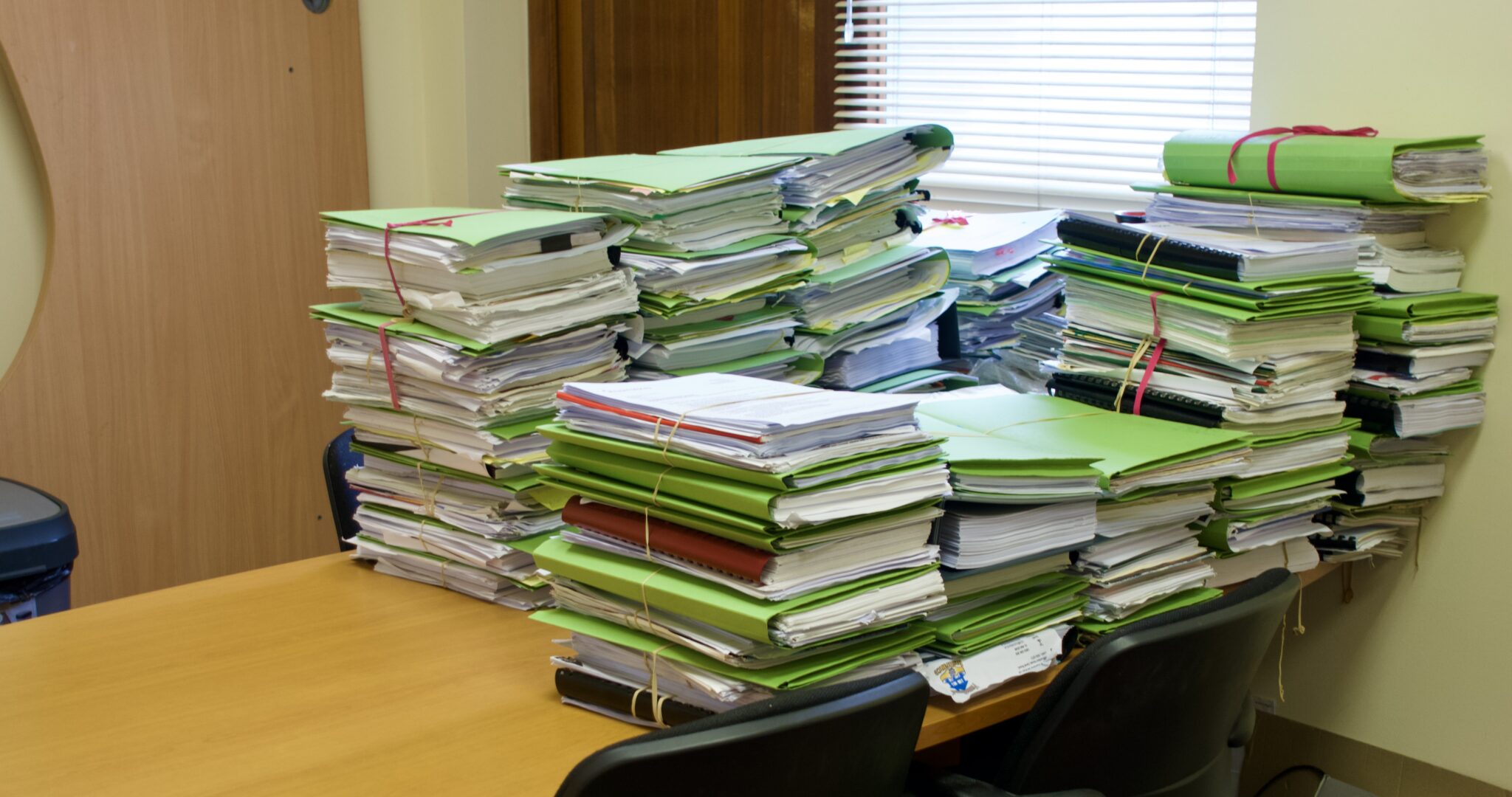 Piles of green, cardboard, pocket folder files – Terry Gorry